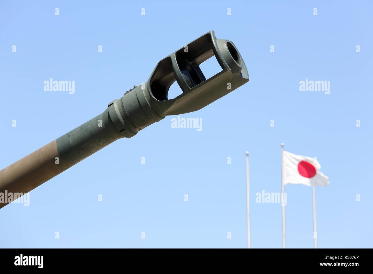 Japanese military cannon with japanese flag against a blue sky Stock ...