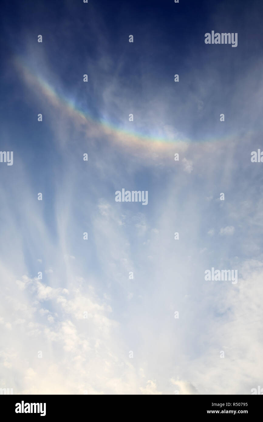 Colorful rainbow radiate from the sun have clouds Stock Photo - Alamy