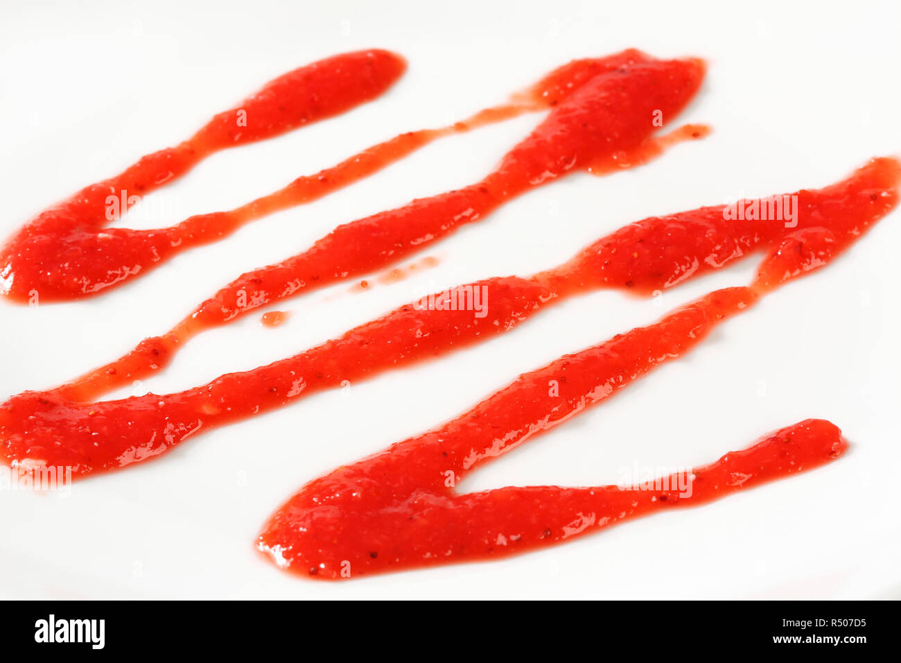 Strawberry drizzle sauce Stock Photo - Alamy