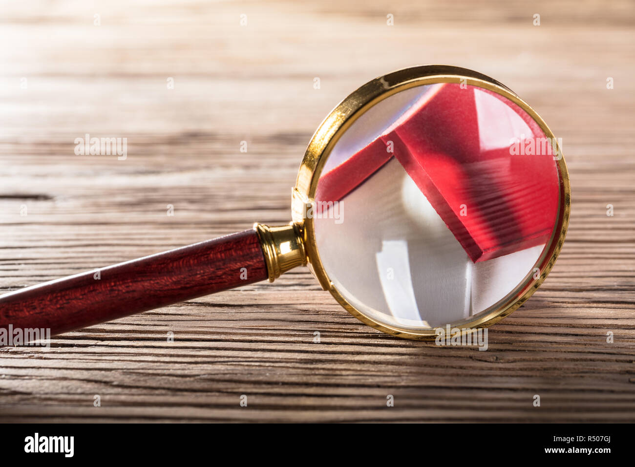 House Model Seen Through Magnifying Glass Stock Photo - Alamy
