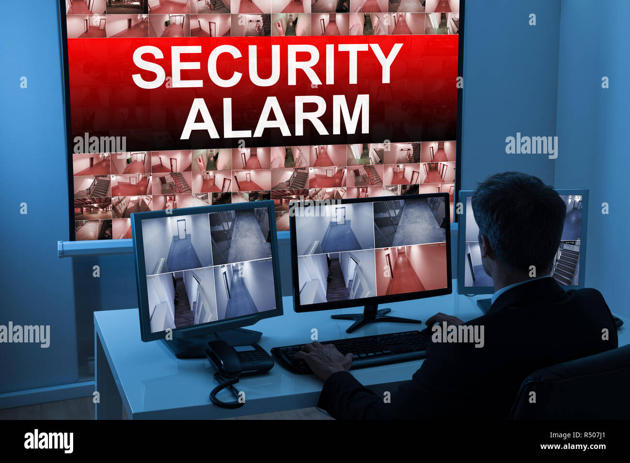 Security guard watching cctv footage hi-res stock photography and ...