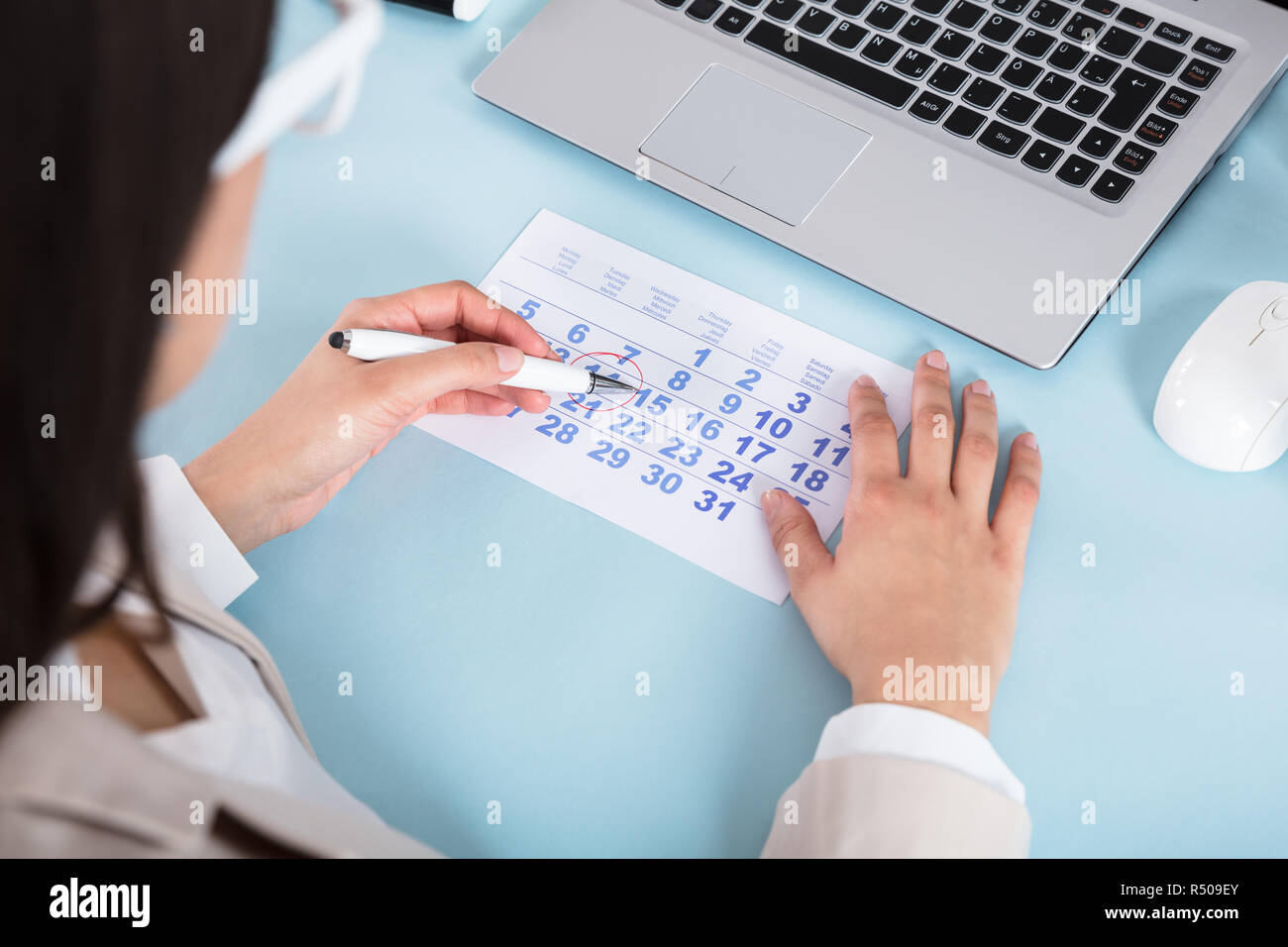 One woman marking the date calendar hi-res stock photography and images ...