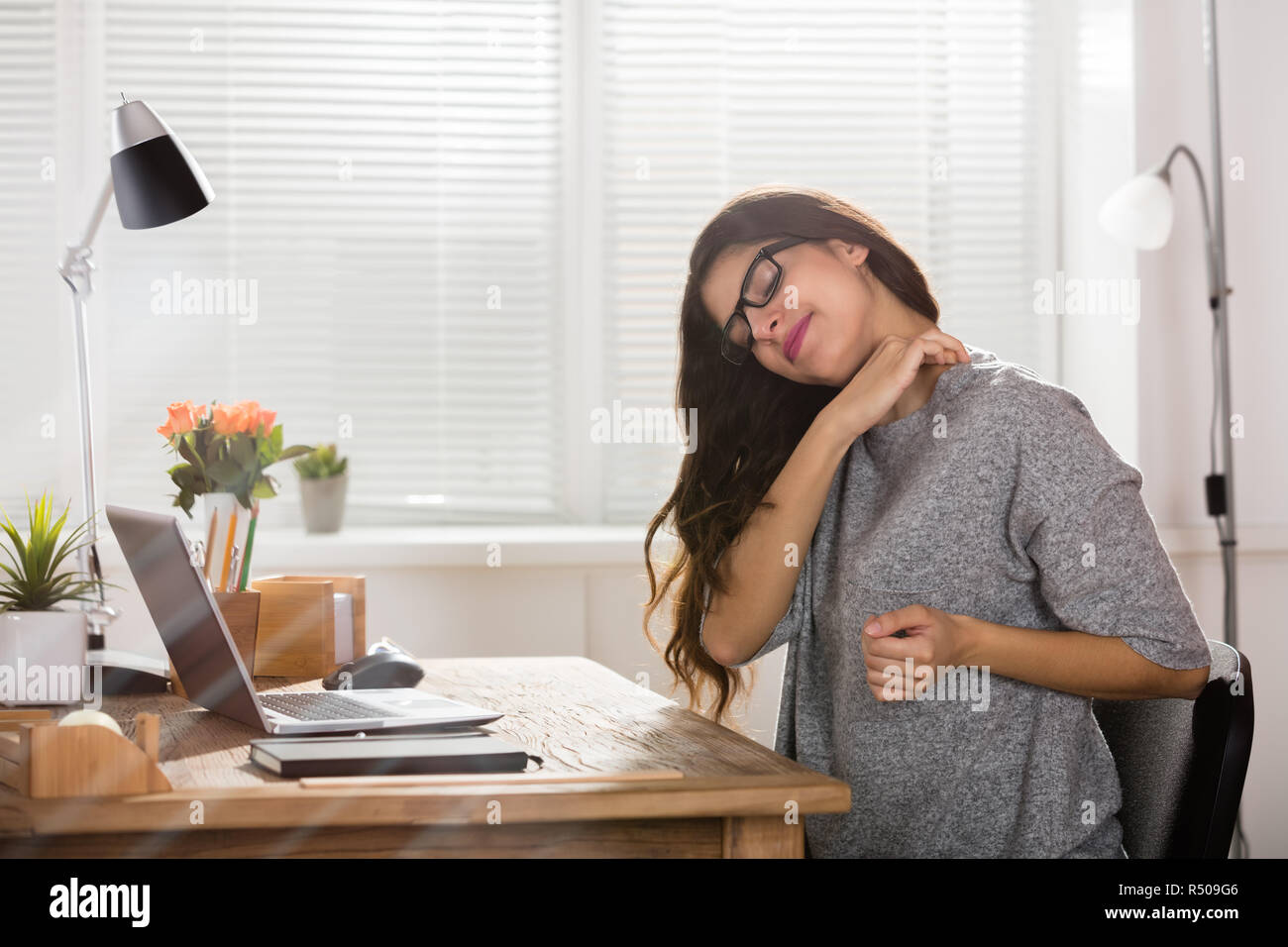 Young businesswoman laptop having neck hi-res stock photography and ...