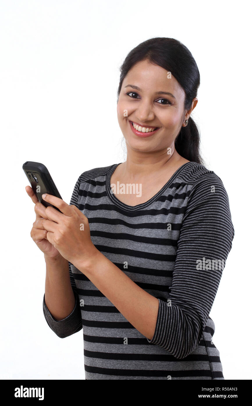 Young woman holding mobile phone hi-res stock photography and images ...