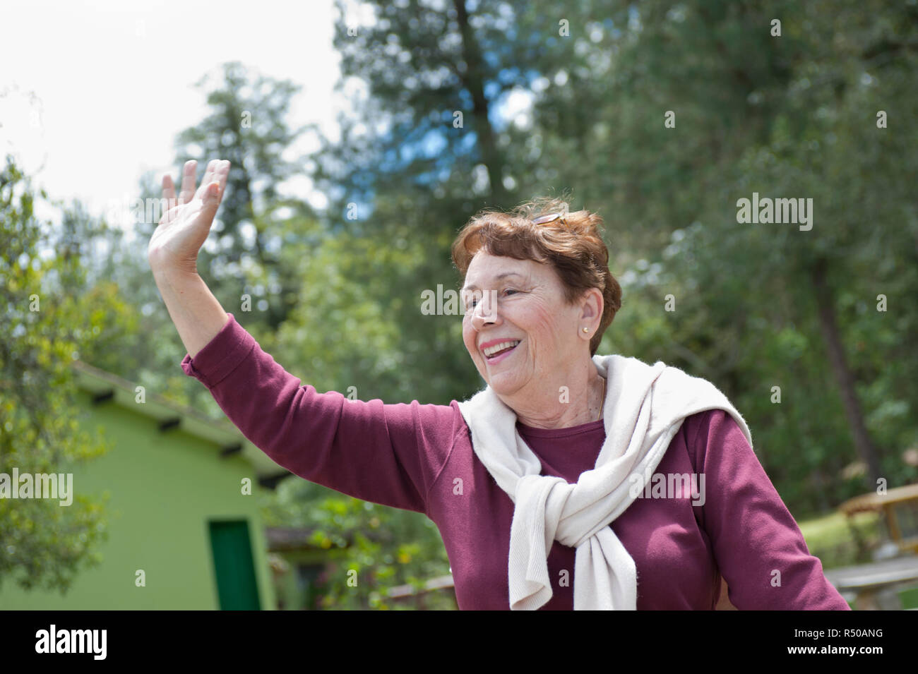 Old lady waving arms hi-res stock photography and images - Alamy