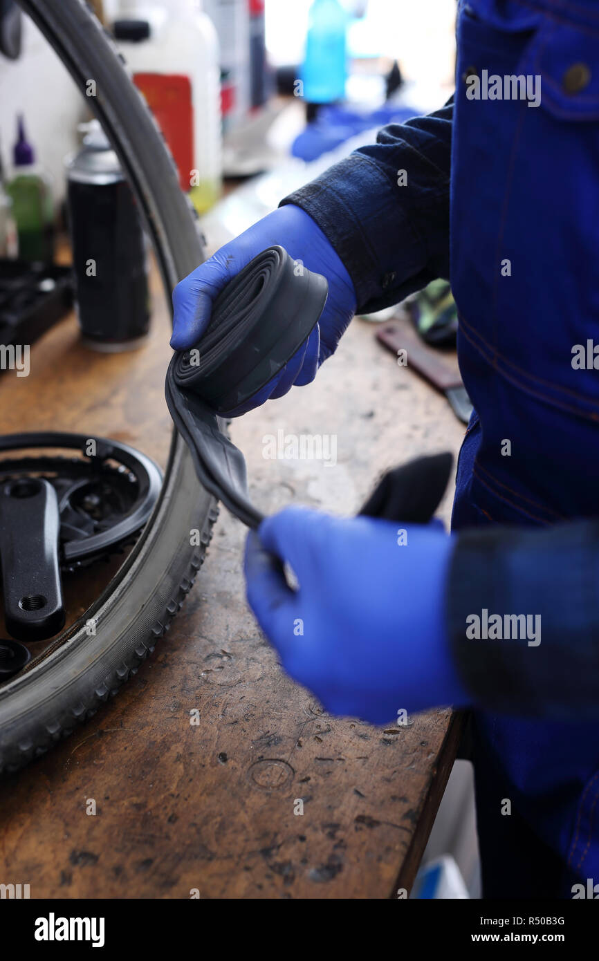 replacement of the inner tube in the bicycle wheel. bike service ...