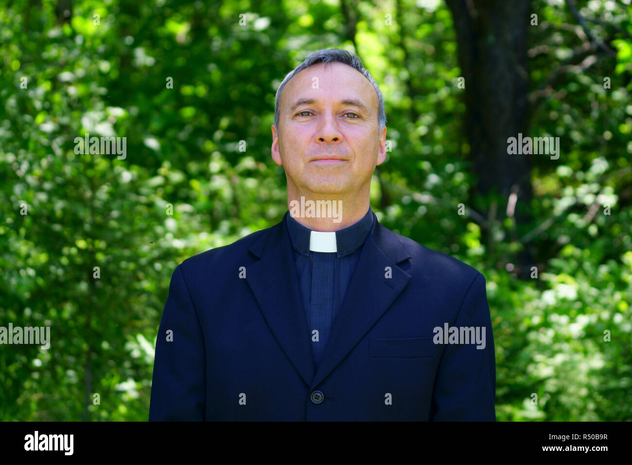 Happy priest hi-res stock photography and images - Alamy