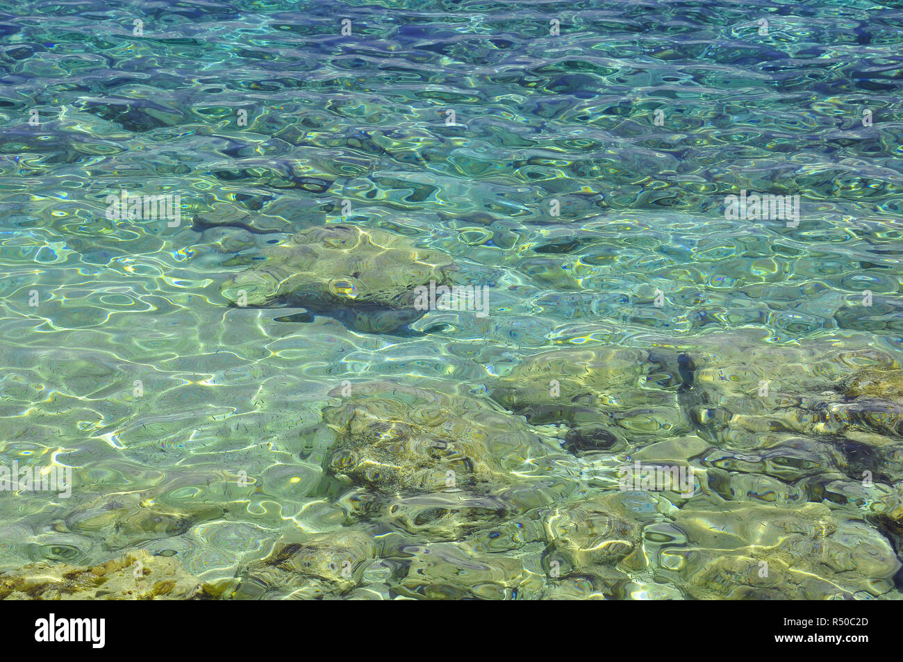 Clear sea water in sunlight Stock Photo - Alamy