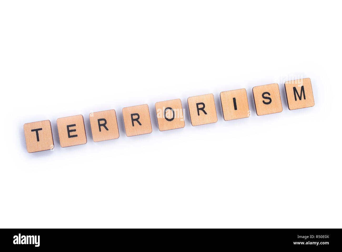 The word TERRORISM, spelt with wooden letter tiles Stock Photo - Alamy