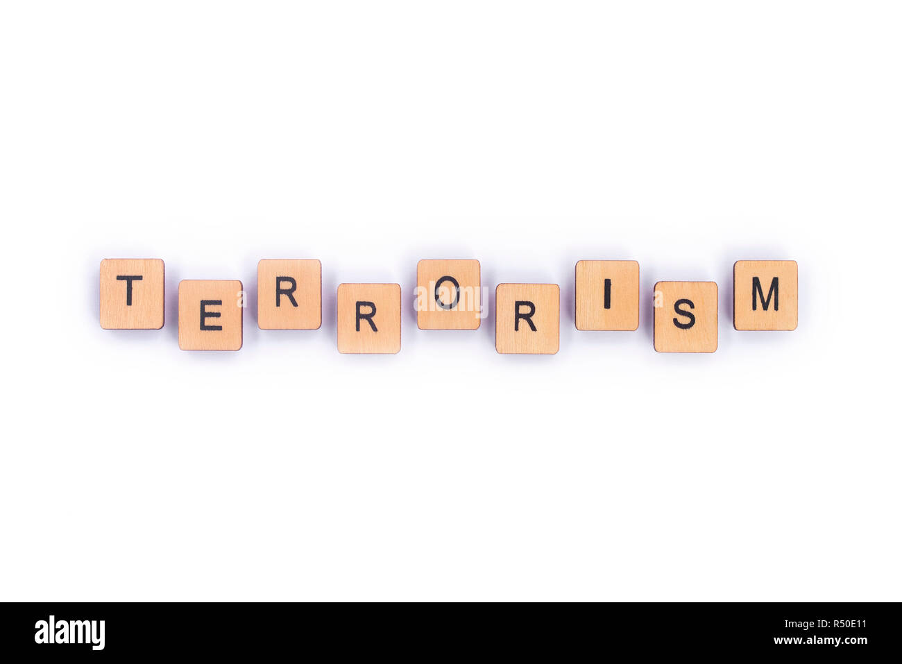 The word TERRORISM, spelt with wooden letter tiles Stock Photo - Alamy