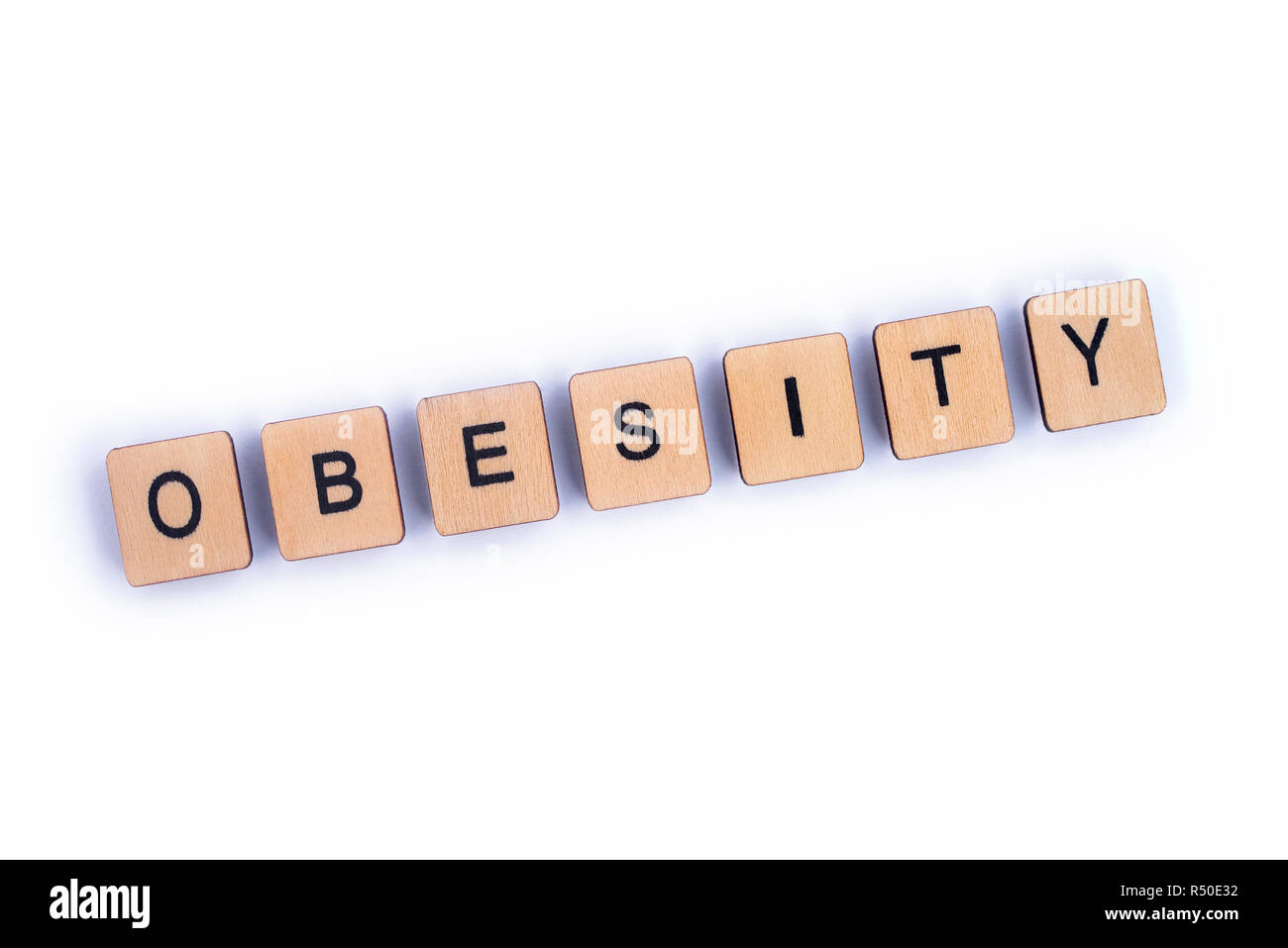 The word OBESITY, spelt with wooden letter tiles Stock Photo - Alamy