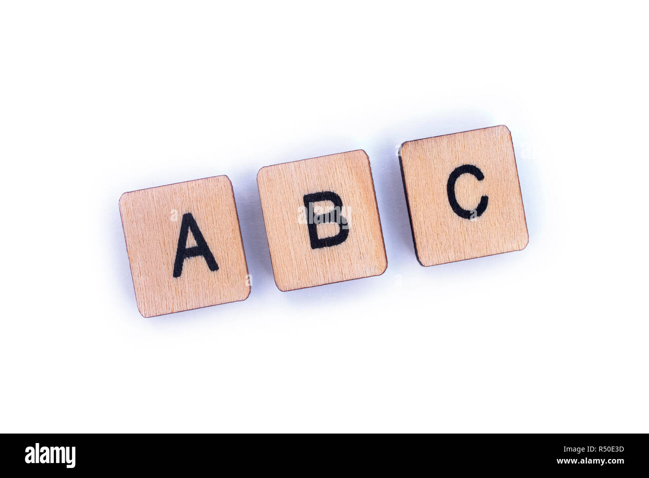 The letters ABC, spelt with wooden letter Scrabble tiles Stock Photo ...