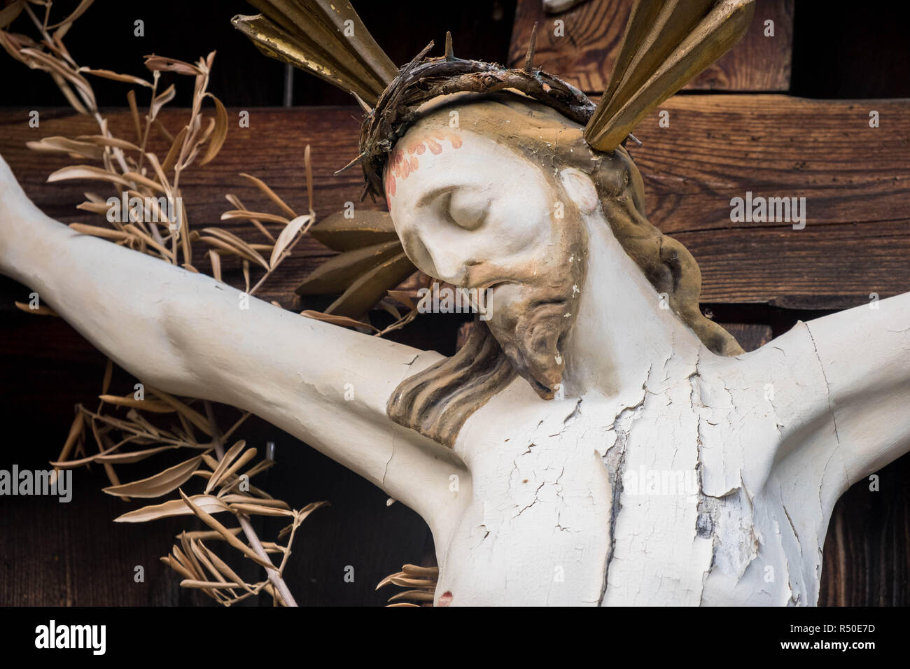 Holy Crucified Jesus Christ close-up. Ancient wooden sculpture Stock Photo - Alamy