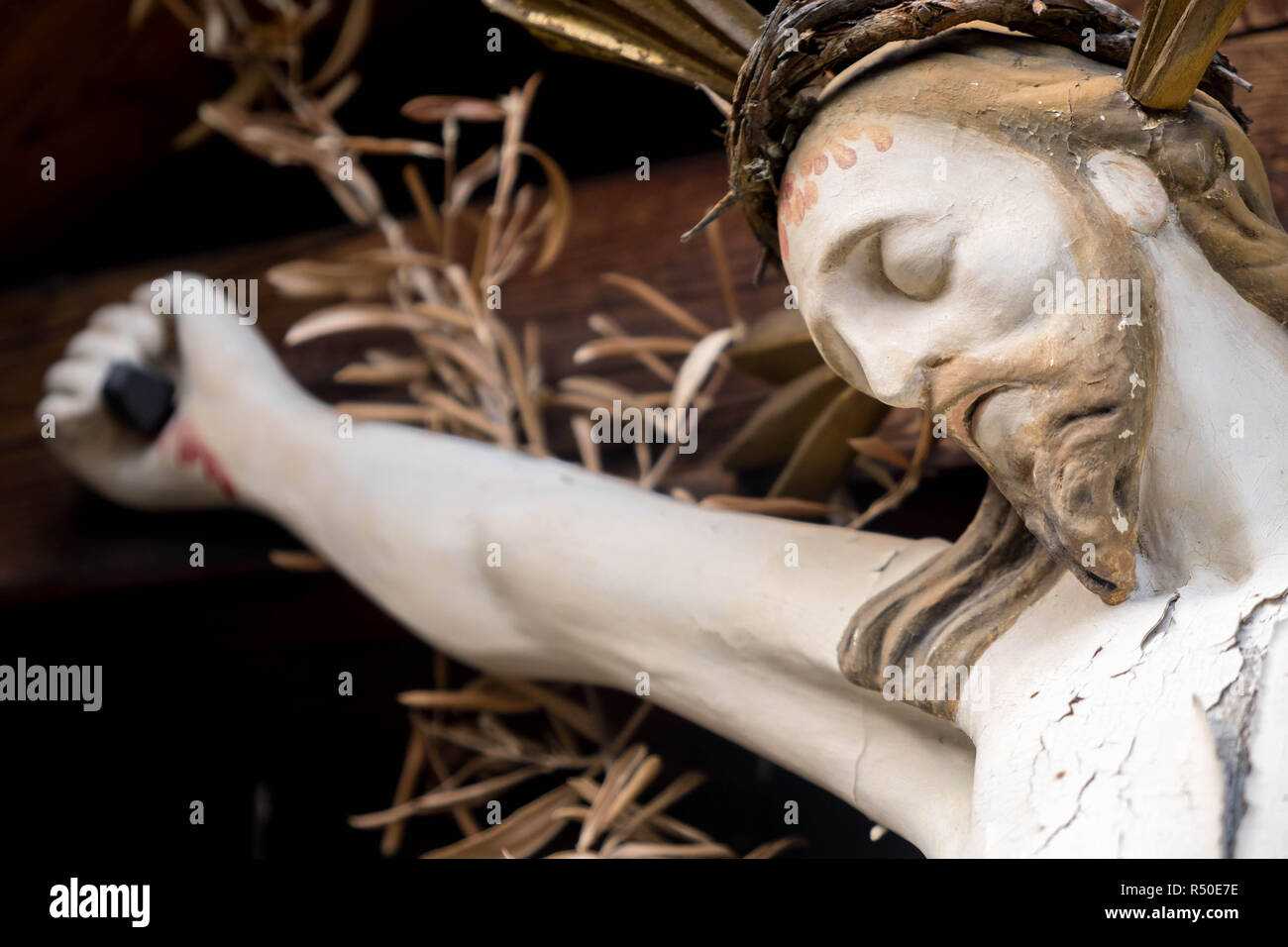 Holy Crucified Jesus Christ close-up. Ancient wooden sculpture Stock Photo - Alamy