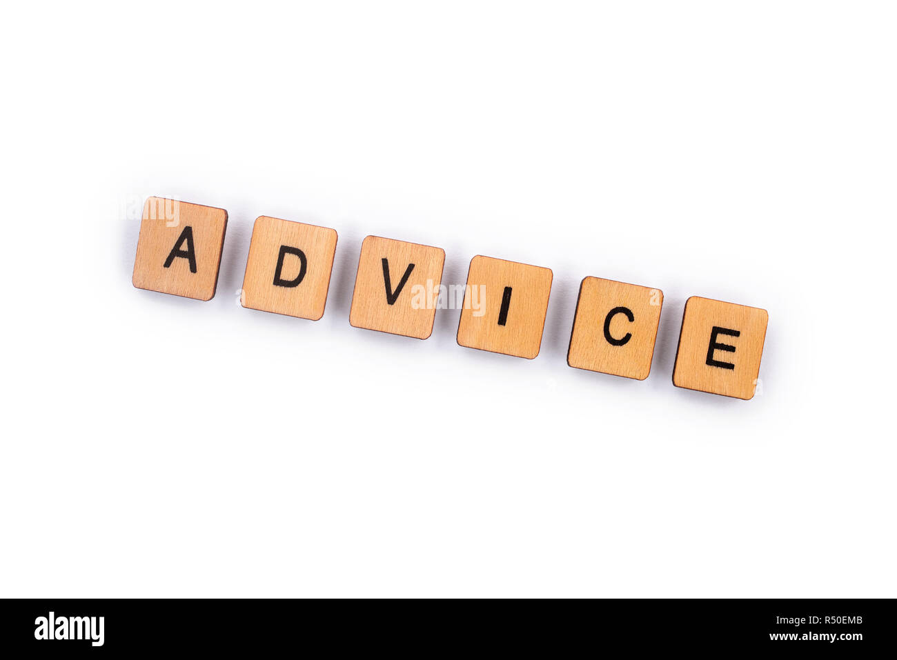 ADVICE, spelt with wooden letter tiles over a plain white background ...