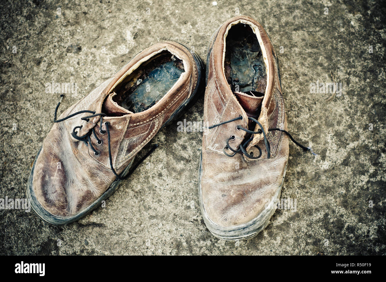 old shoes on the floor Stock Photo - Alamy
