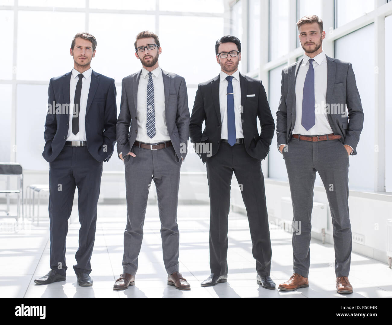 four businessmen standing together Stock Photo - Alamy four businessmen standing together Stock Photo - Alamy