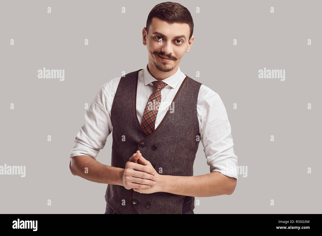 Portrait of handsome young confident arabic businessman with fancy ...