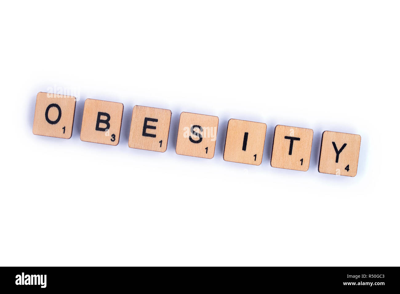 LONDON, UK - JULY 8TH 2018: The word OBESITY, spelt with wooden letter ...