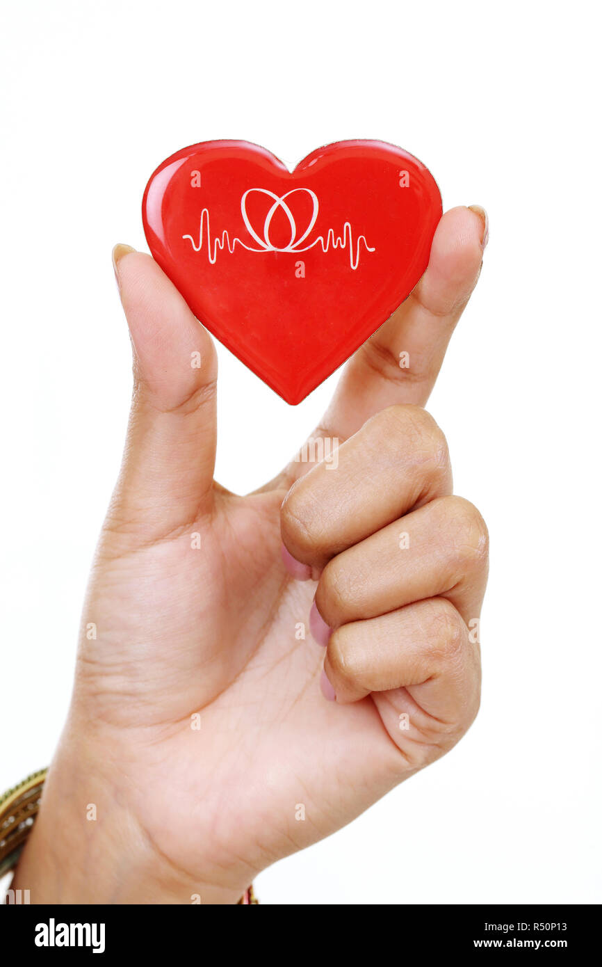 Red heart shape in woman's hand isolated on white background Stock ...