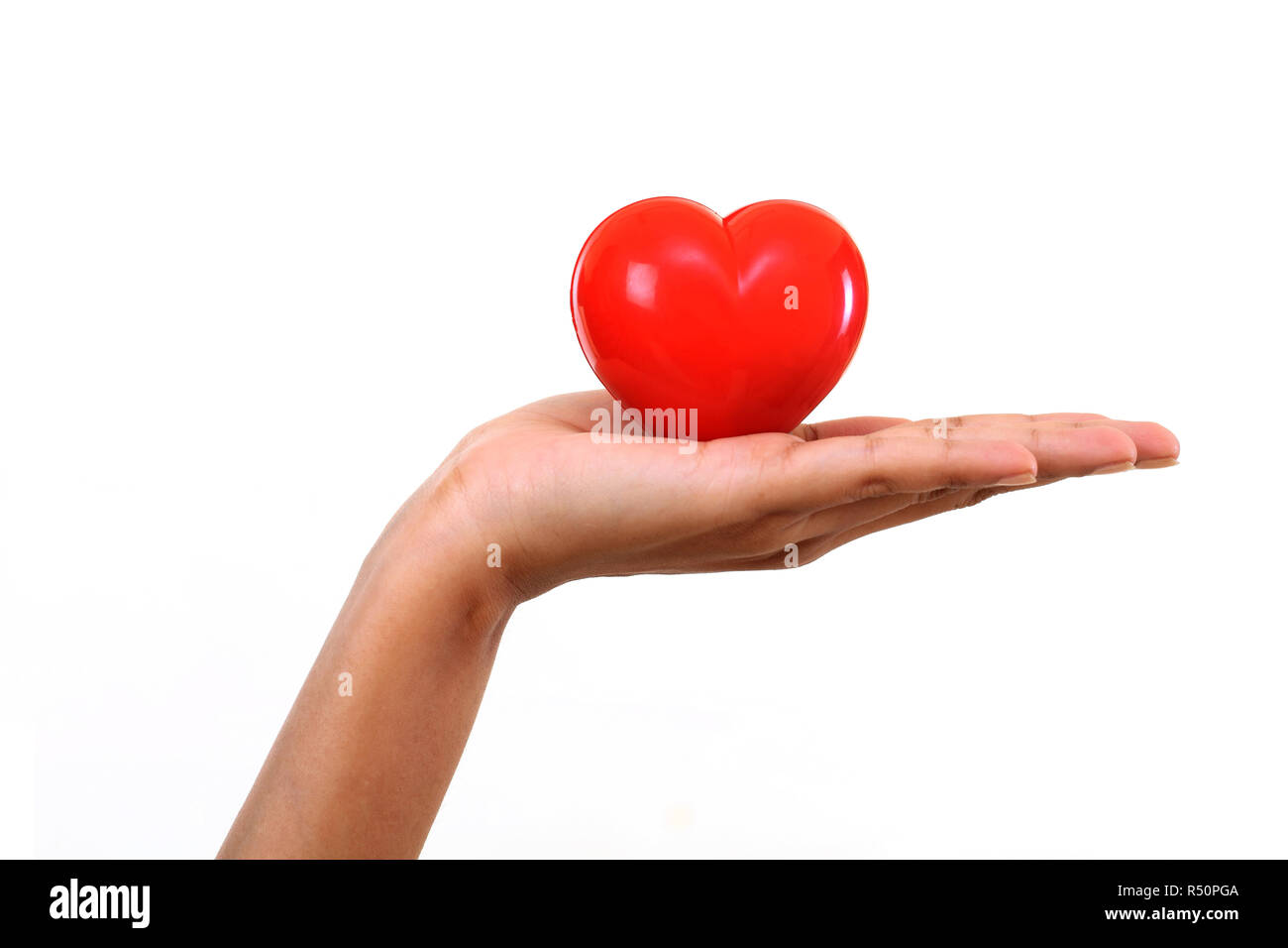 Hand holding Red heart shape Stock Photo - Alamy