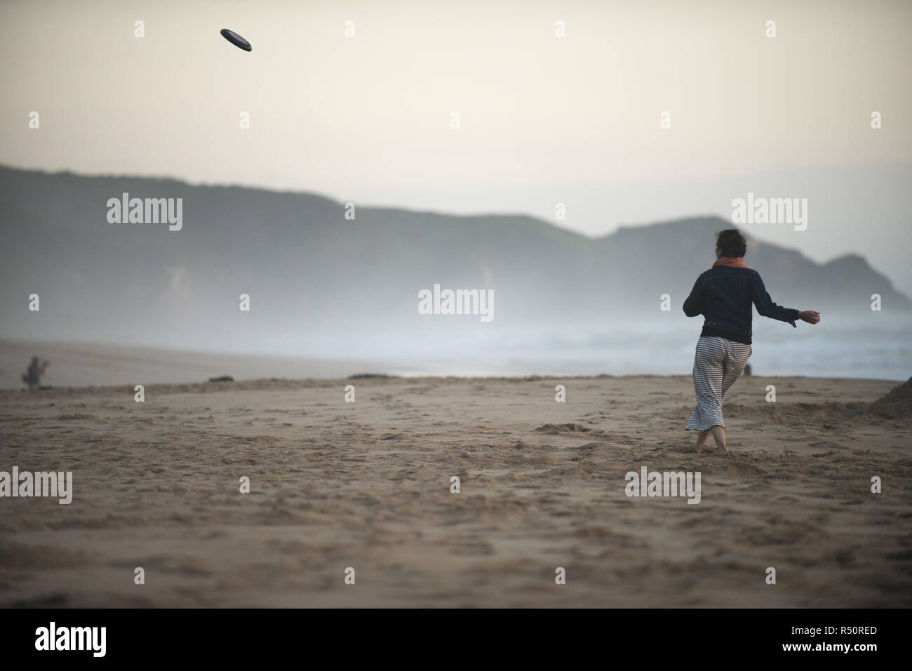Playing catch on beach hi-res stock photography and images - Alamy