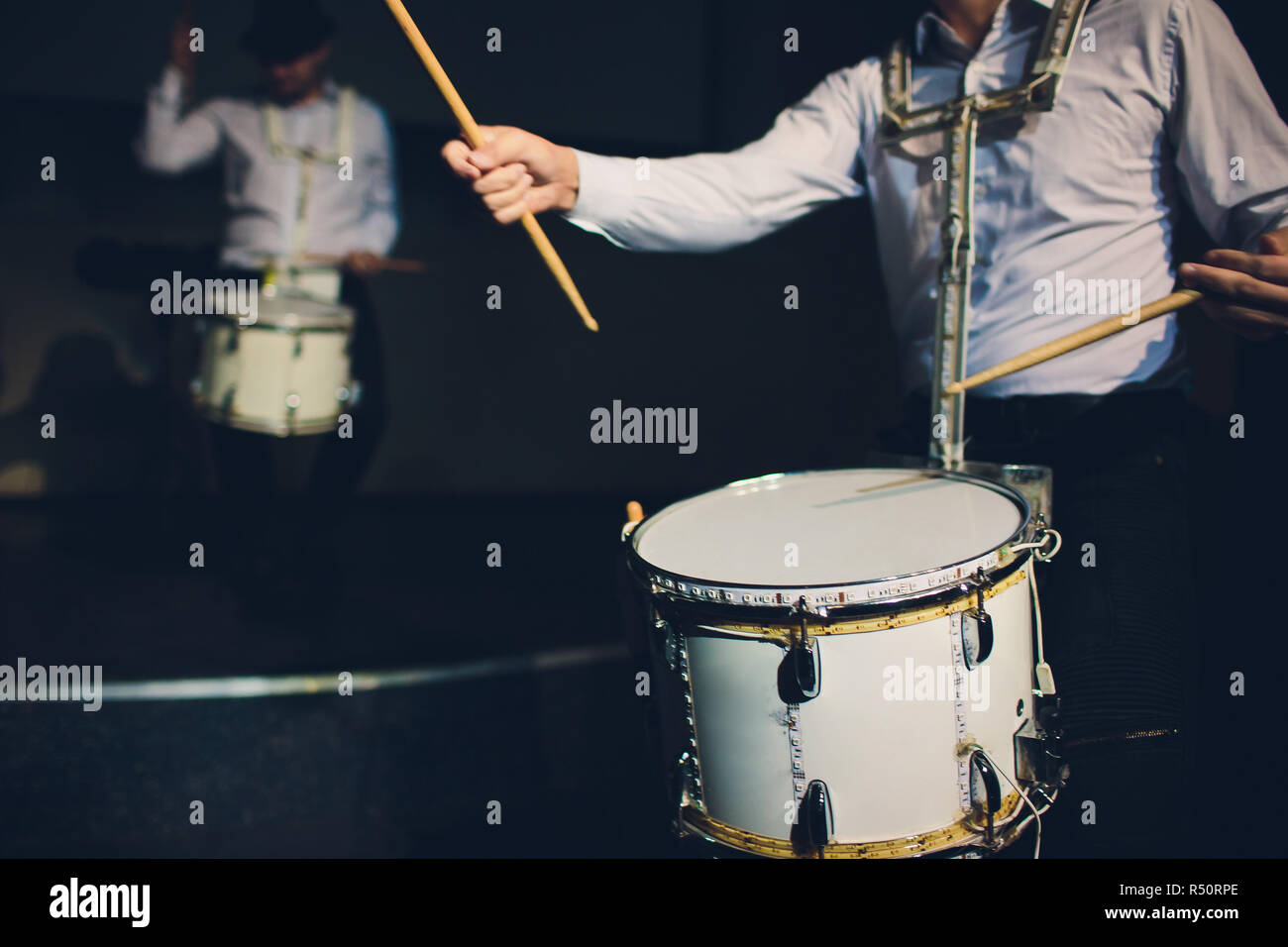 Drummer.The guy holding the drumsticks in his hand.Young man with ...