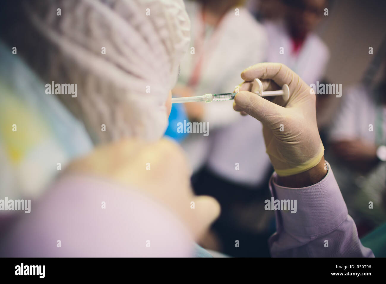 Hand holding syringe and vaccine.Syringe medical injection Liquid drug ...