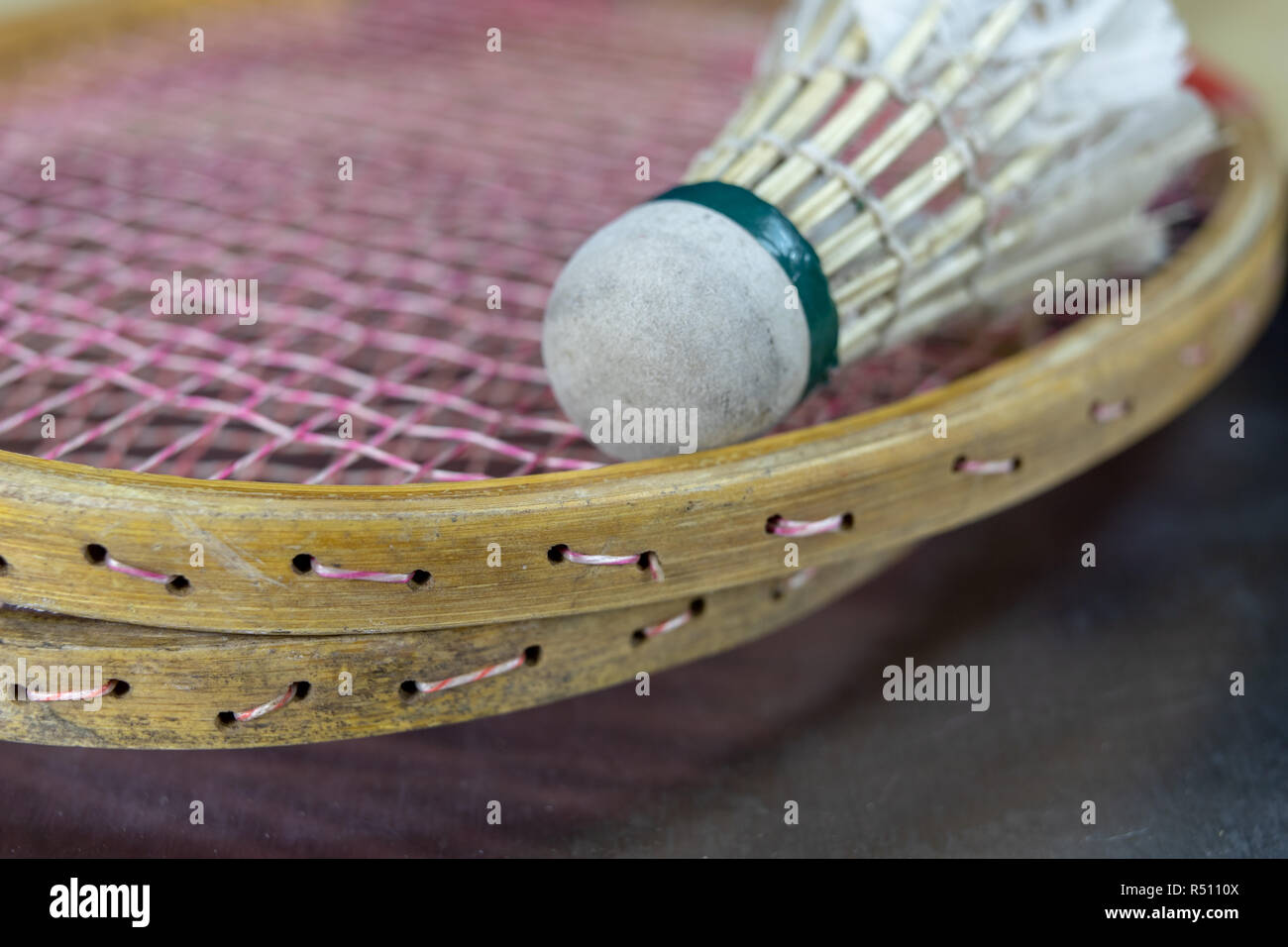 Old badminton accessories on a light table. Set for outdoor games and ...