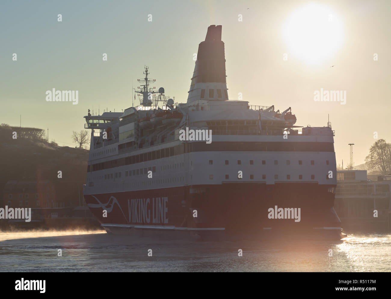 Viking Line ferry turning in foggy morning Stockholm harbor, Sweden ...
