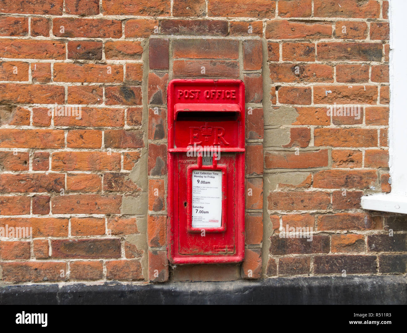 Cast iron ER II Post Office Post Box mounter in brick wall Stock Photo ...