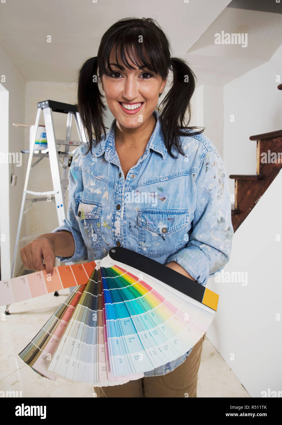 Woman paint swatch looking at camera hi-res stock photography and ...