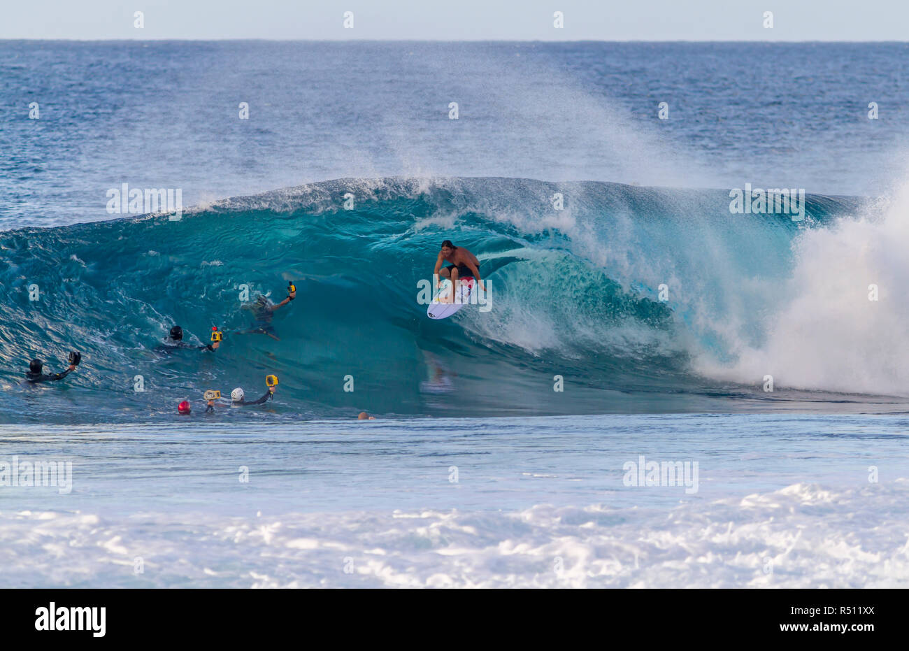 1/08/18, Haleiwa Hawaii: Surfers being photographed while riding waves ...