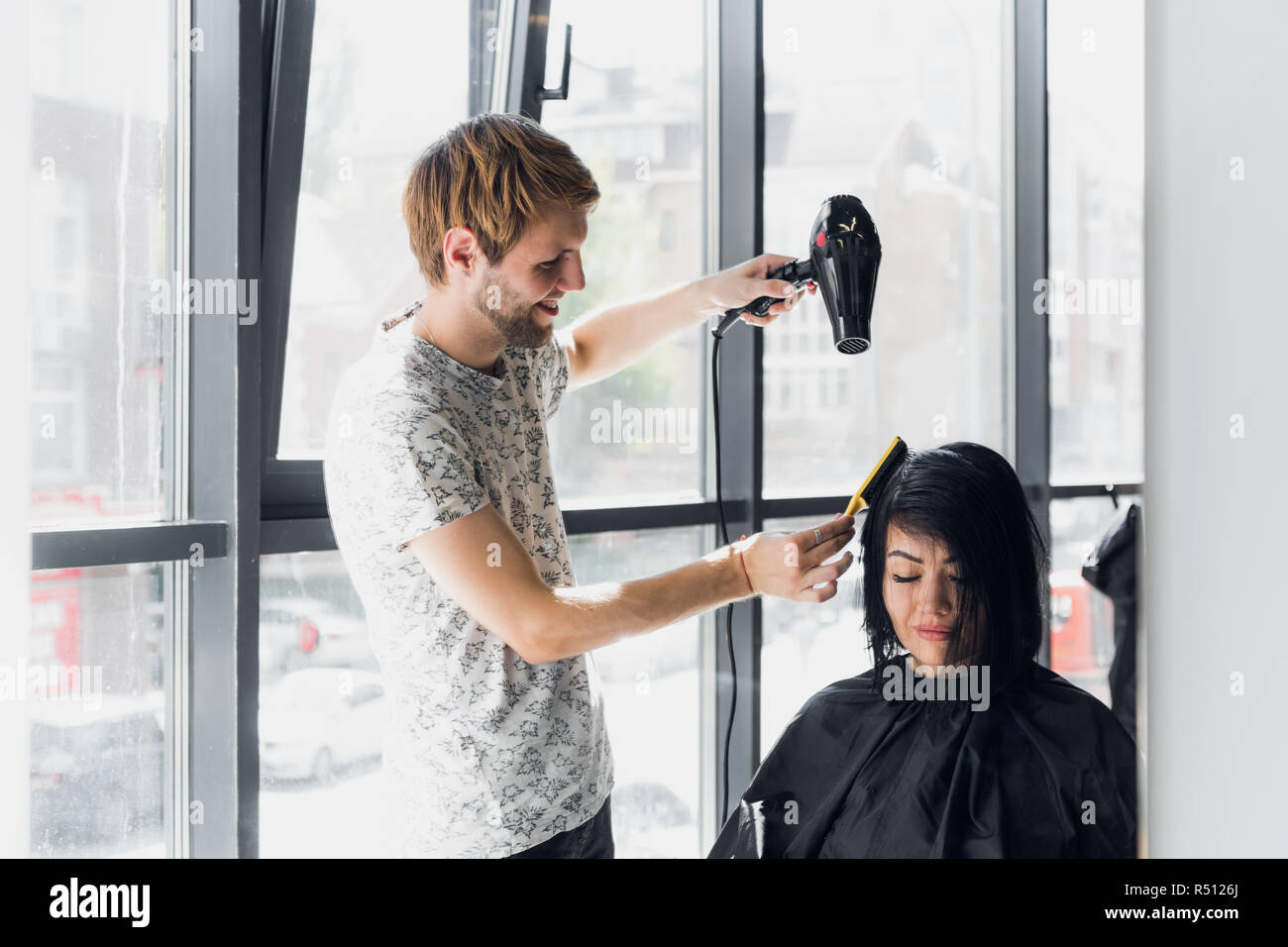 Woman getting haircut hi-res stock photography and images - Alamy