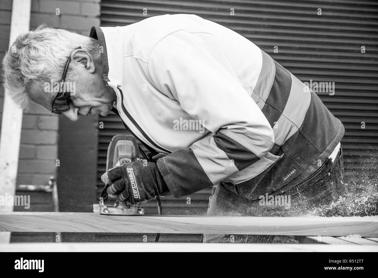 Carpenter wearing high visibility jacket Black and White Stock Photos ...