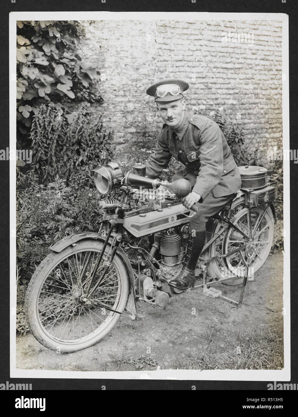 A dispatch rider in France. A dispatch rider posed on his motorcycle ...