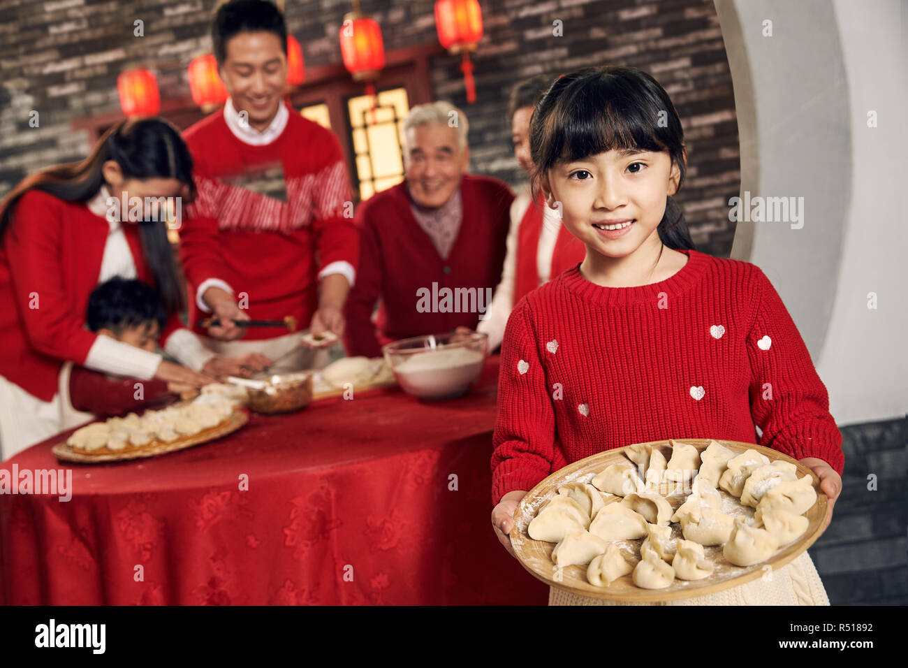 Happy Chinese New Year pack dumpling family Stock Photo - Alamy
