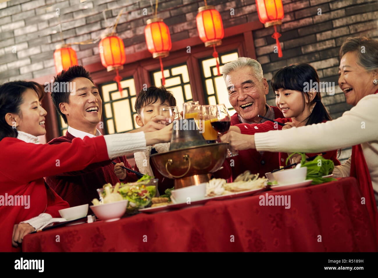Happy family reunion dinner Stock Photo - Alamy