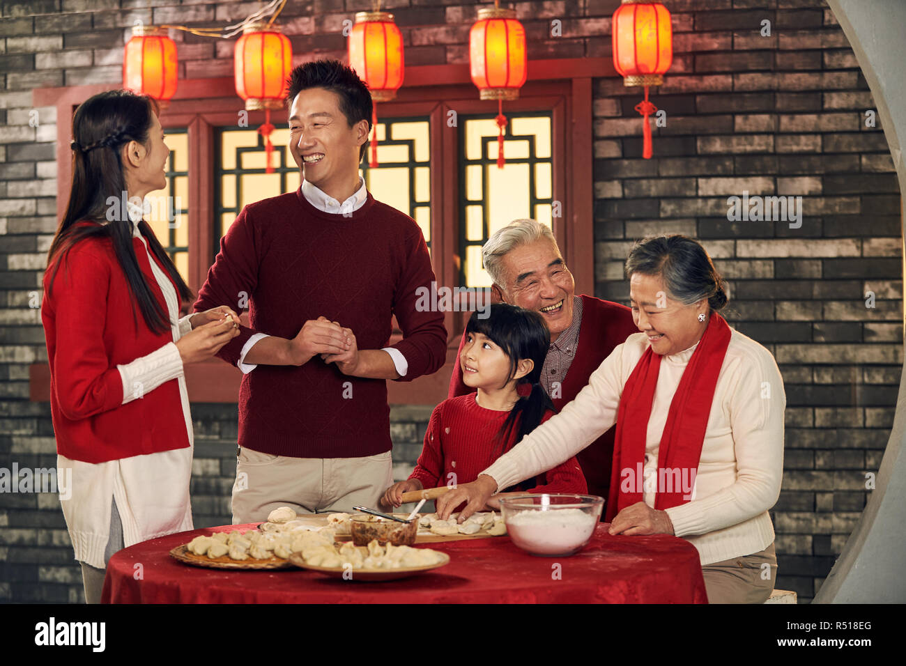 Happy Chinese New Year pack dumpling family Stock Photo - Alamy