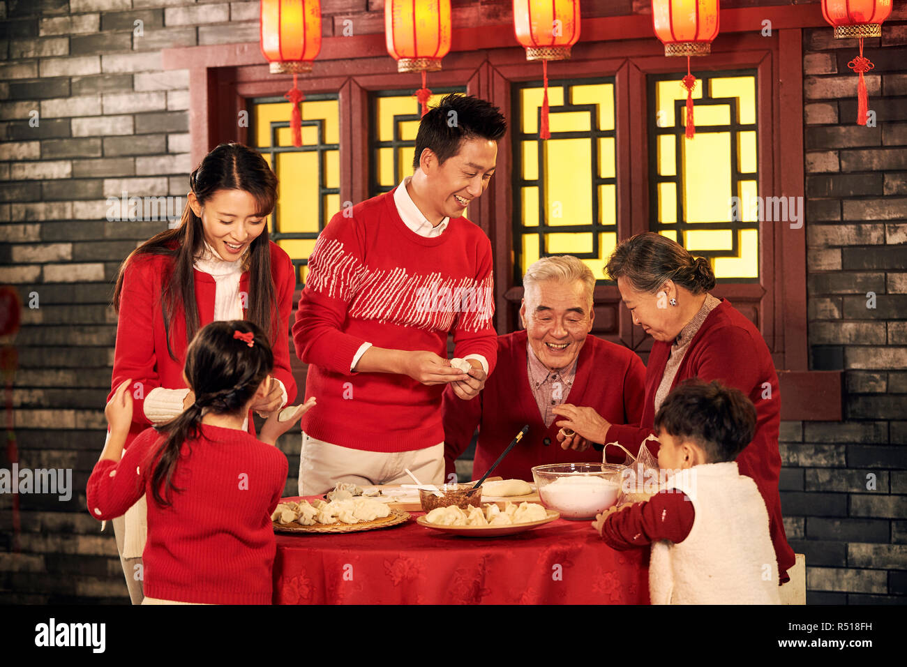 Happy Chinese New Year pack dumpling family Stock Photo - Alamy