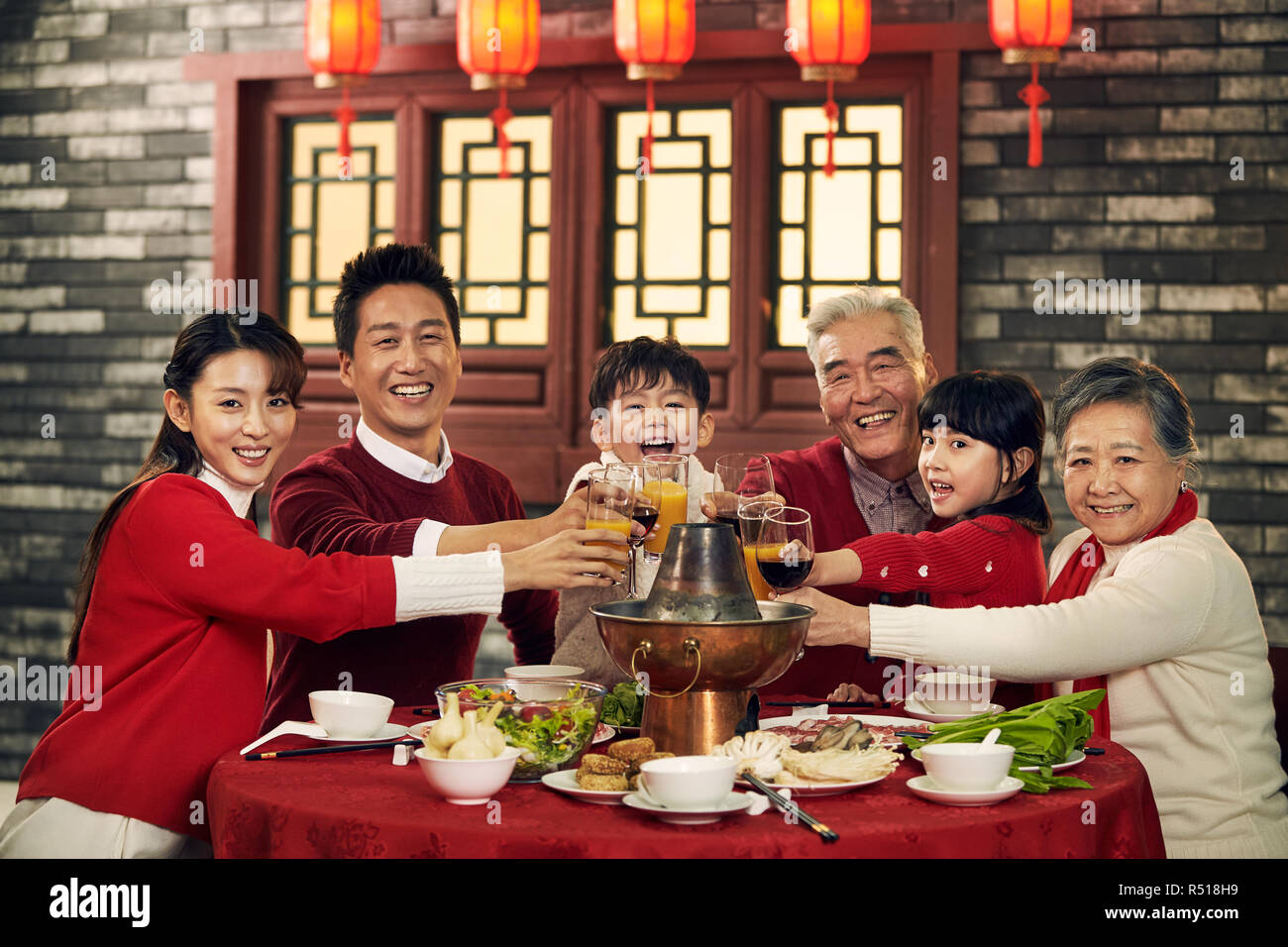 Happy family reunion dinner Stock Photo - Alamy