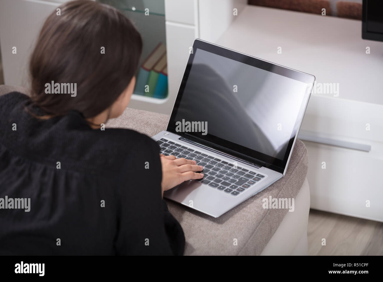 Teenagers laptop rear view hi-res stock photography and images - Alamy