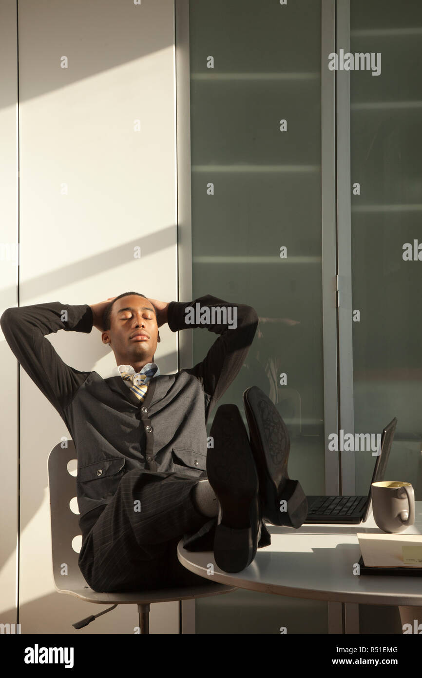 Seated young man resting arm hi-res stock photography and images - Alamy