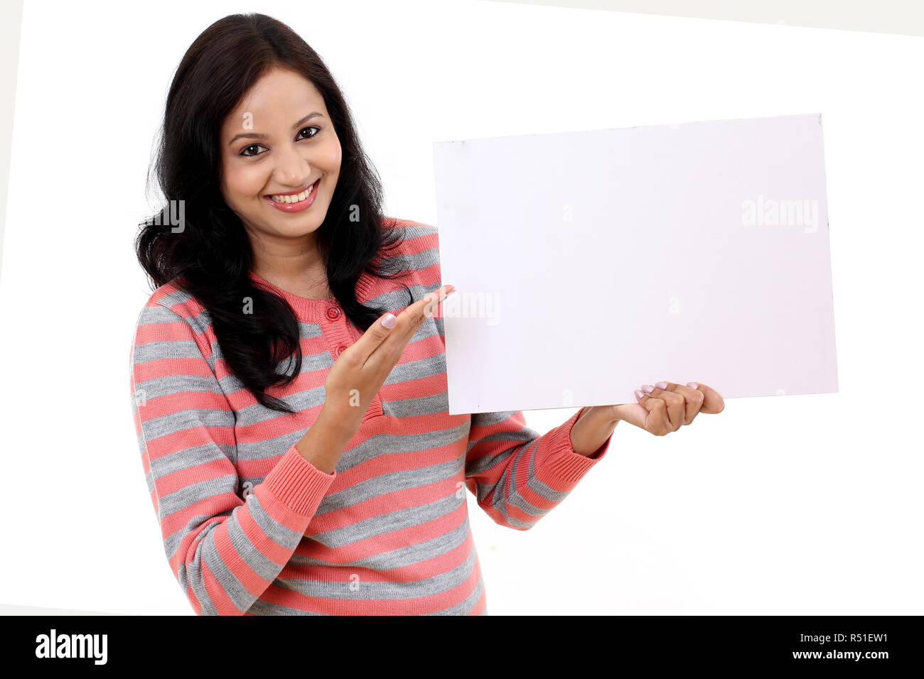 Cheerful young woman holding empty white board Stock Photo - Alamy Cheerful young woman holding empty white board Stock Photo - Alamy