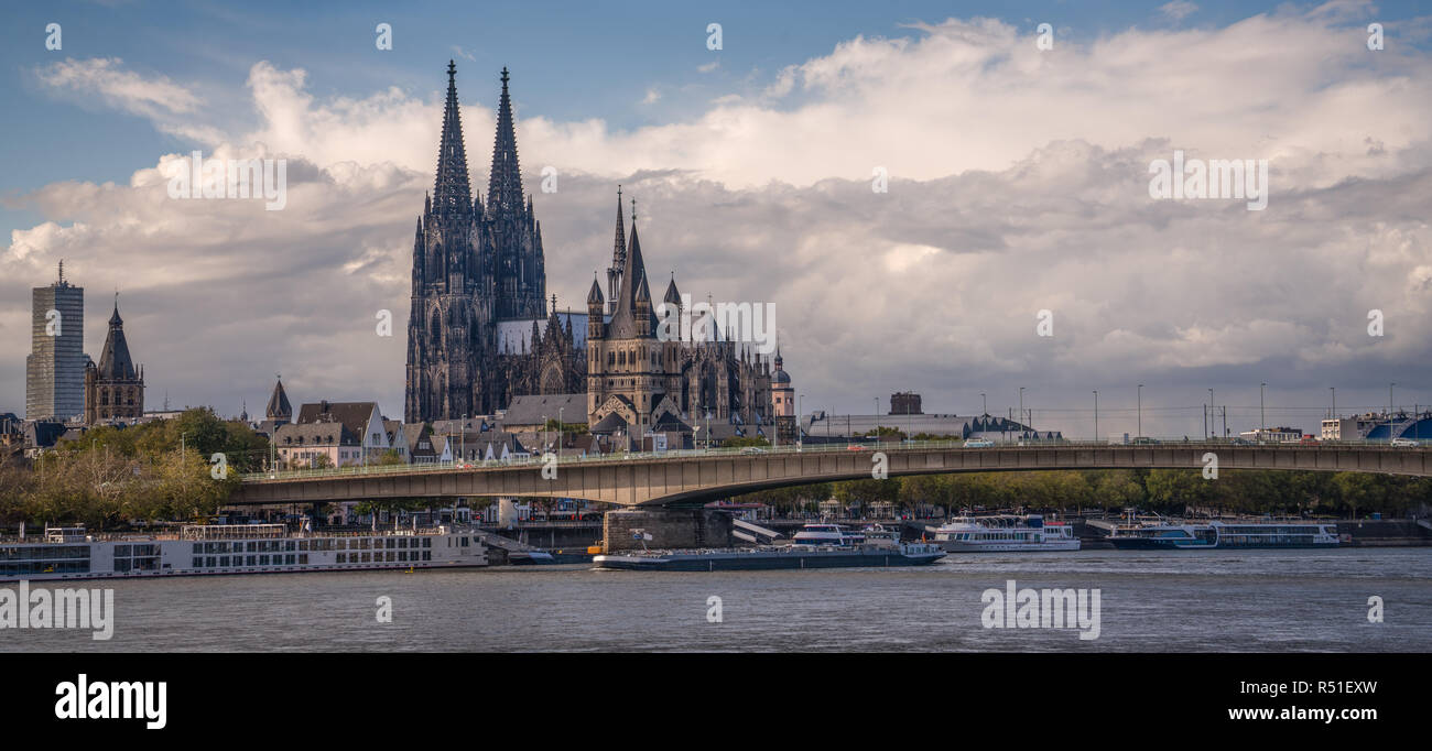 Cologne cityscape with cathedral towering over river and bridge Stock ...