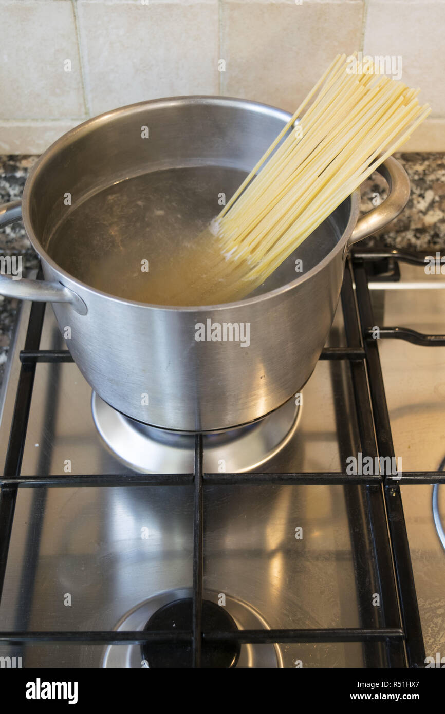 cooking spaghetti in pan Stock Photo - Alamy