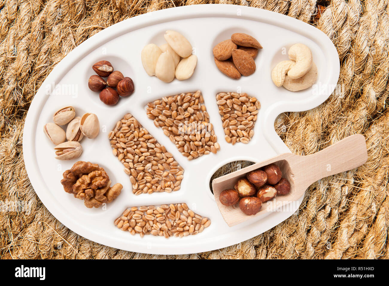 artist pallets with nuts and grains on sisal Stock Photo - Alamy