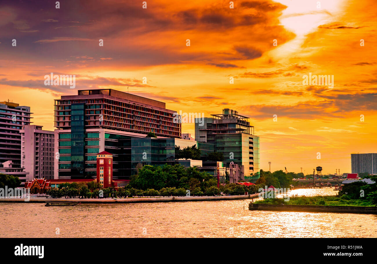 Cityscape of modern building near the river in the morning at sunrise ...