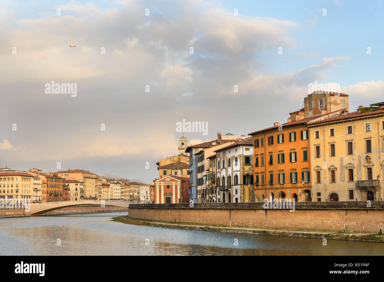 View on embankment of Arno river and bridge Ponte Di Mezzo in Pisa ...