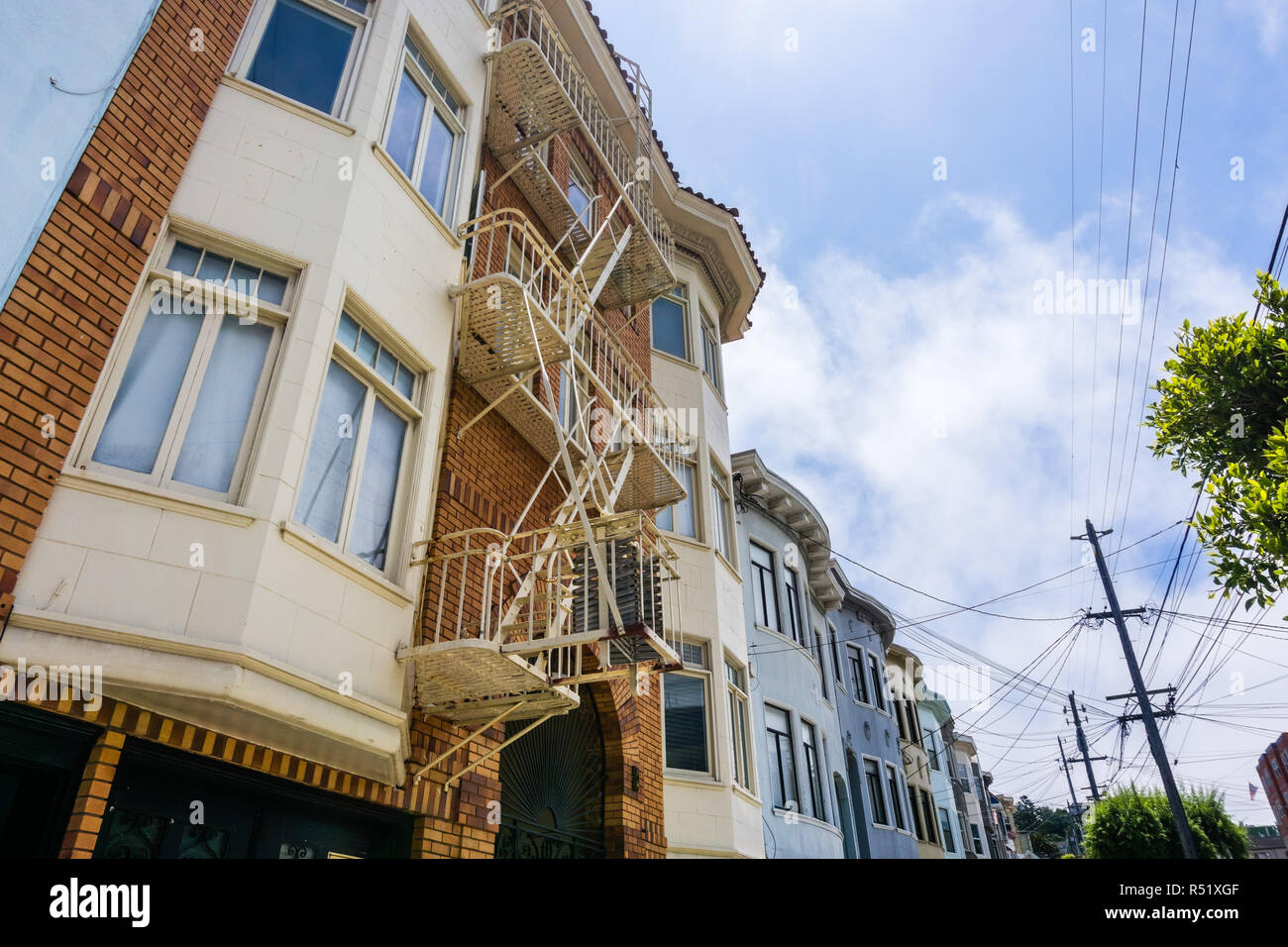 Street view of rows of multi unit buildings in one of the San Francisco ...